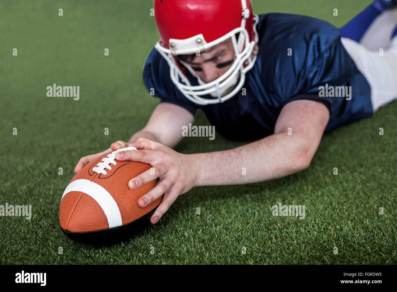 American football player scoring a touchdown Stock Photo - Alamy