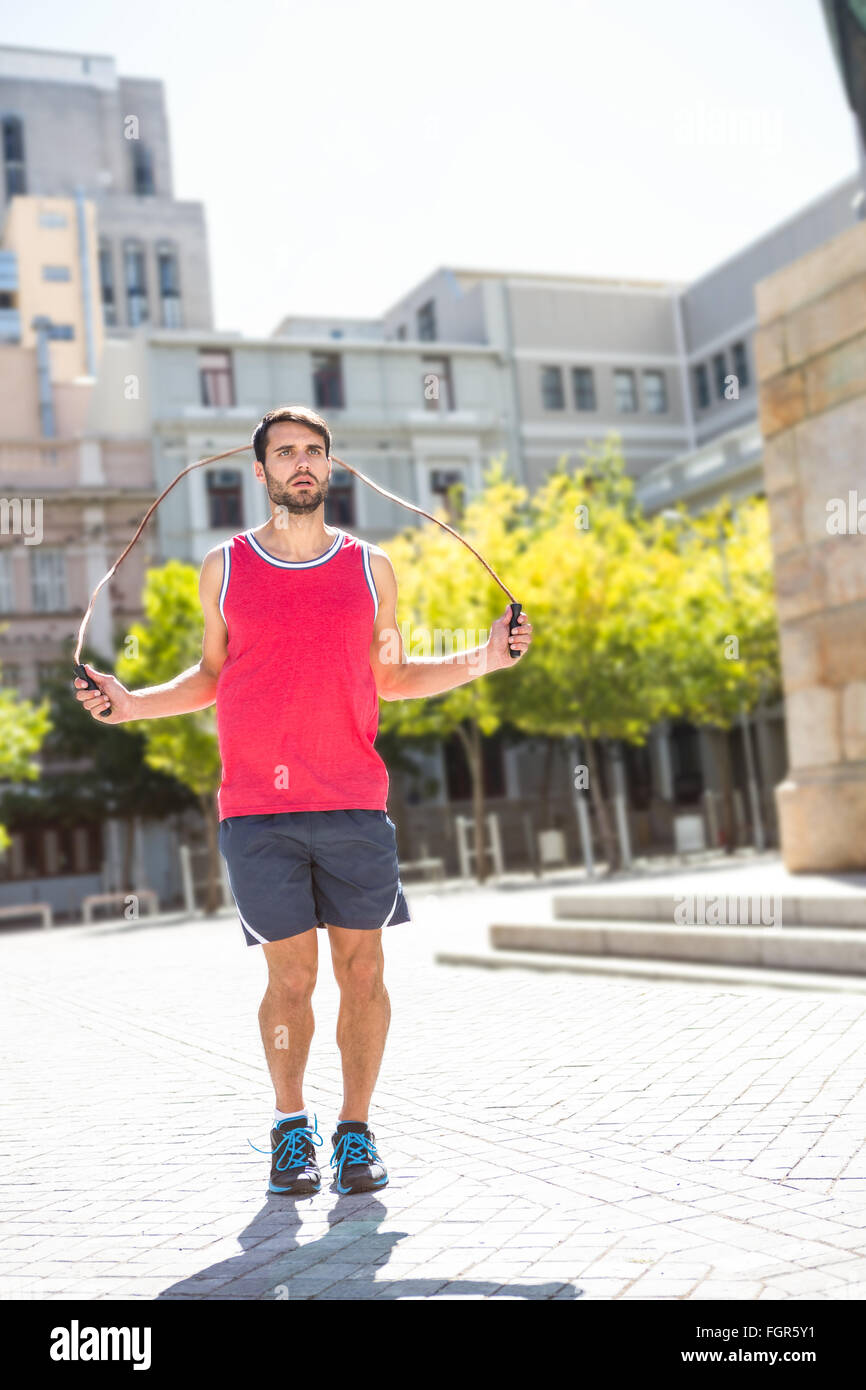 Handsome athlete doing jumping rope Stock Photo - Alamy
