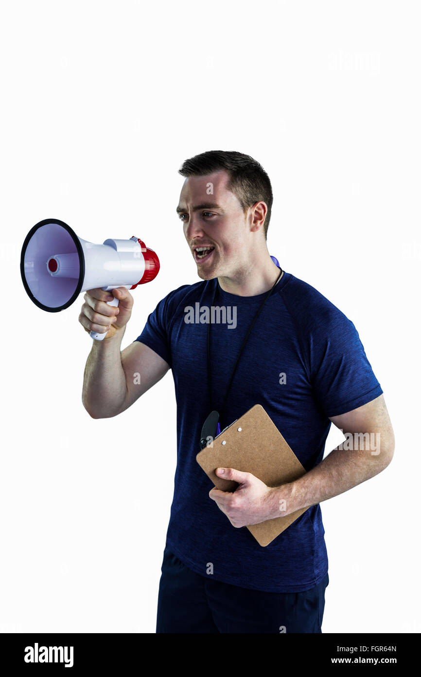 Male trainer yelling through the megaphone Stock Photo - Alamy