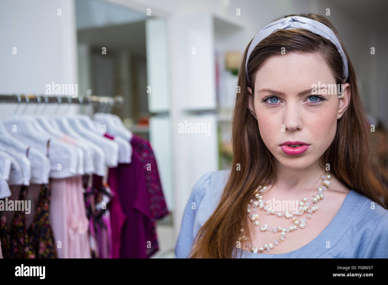 Brunette pouting at the camera Stock Photo - Alamy