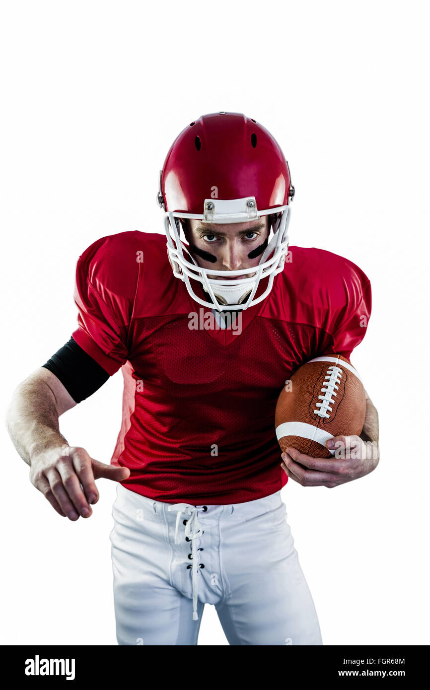 Portrait of focused american football player being ready to attack ...