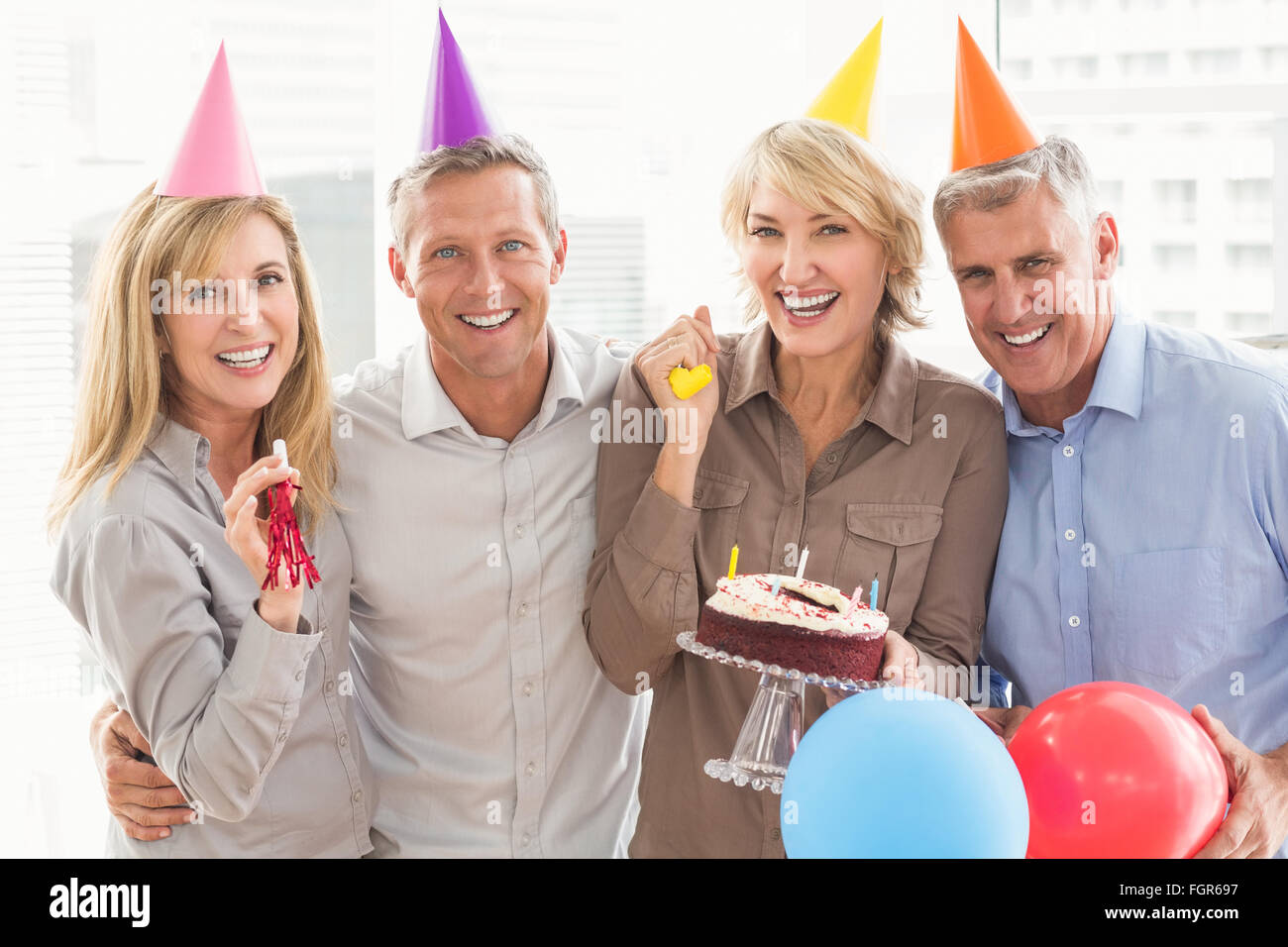Happy casual business people celebrating birthday Stock Photo - Alamy