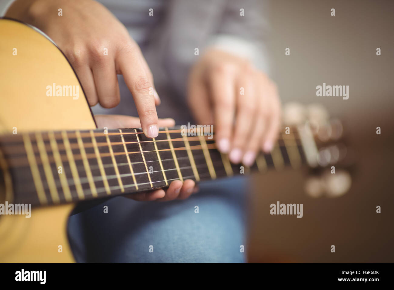 Teaching guitar lessons hi-res stock photography and images - Alamy