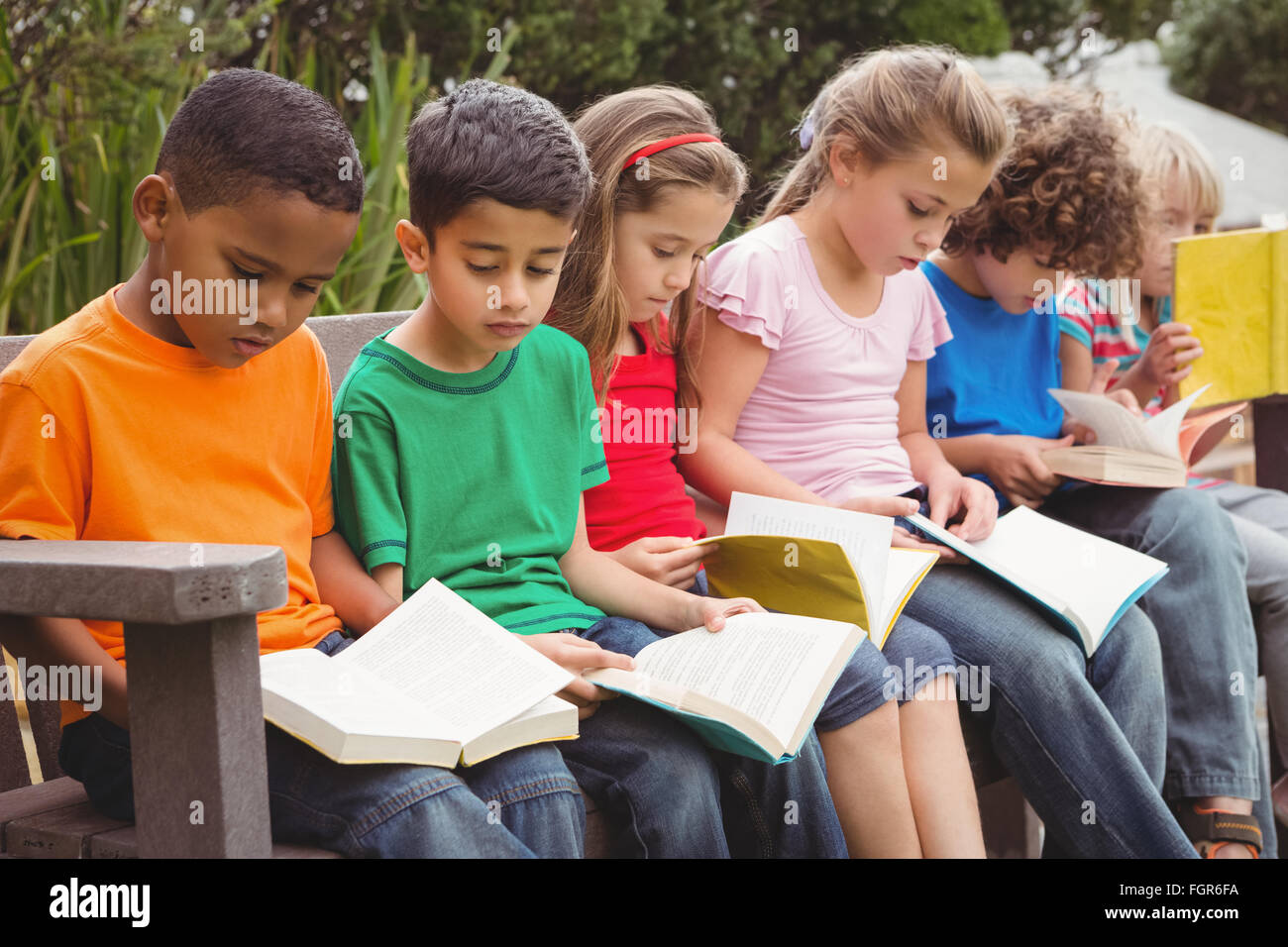 Children reading from books together Stock Photo - Alamy