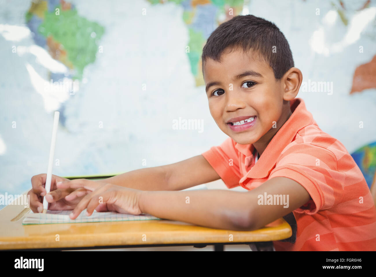 Smiling student doing class work Stock Photo - Alamy
