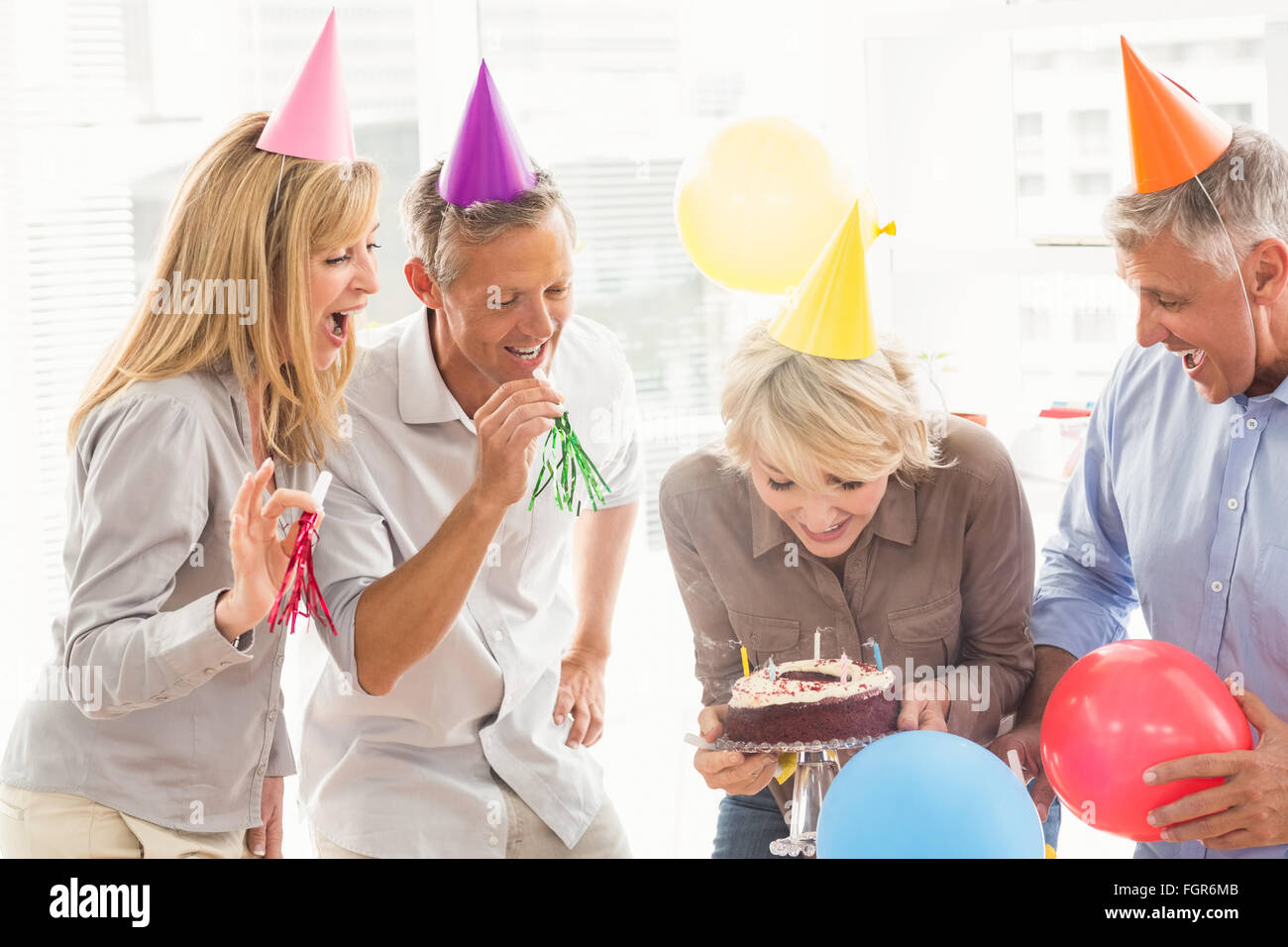 Casual business people celebrating birthday Stock Photo - Alamy