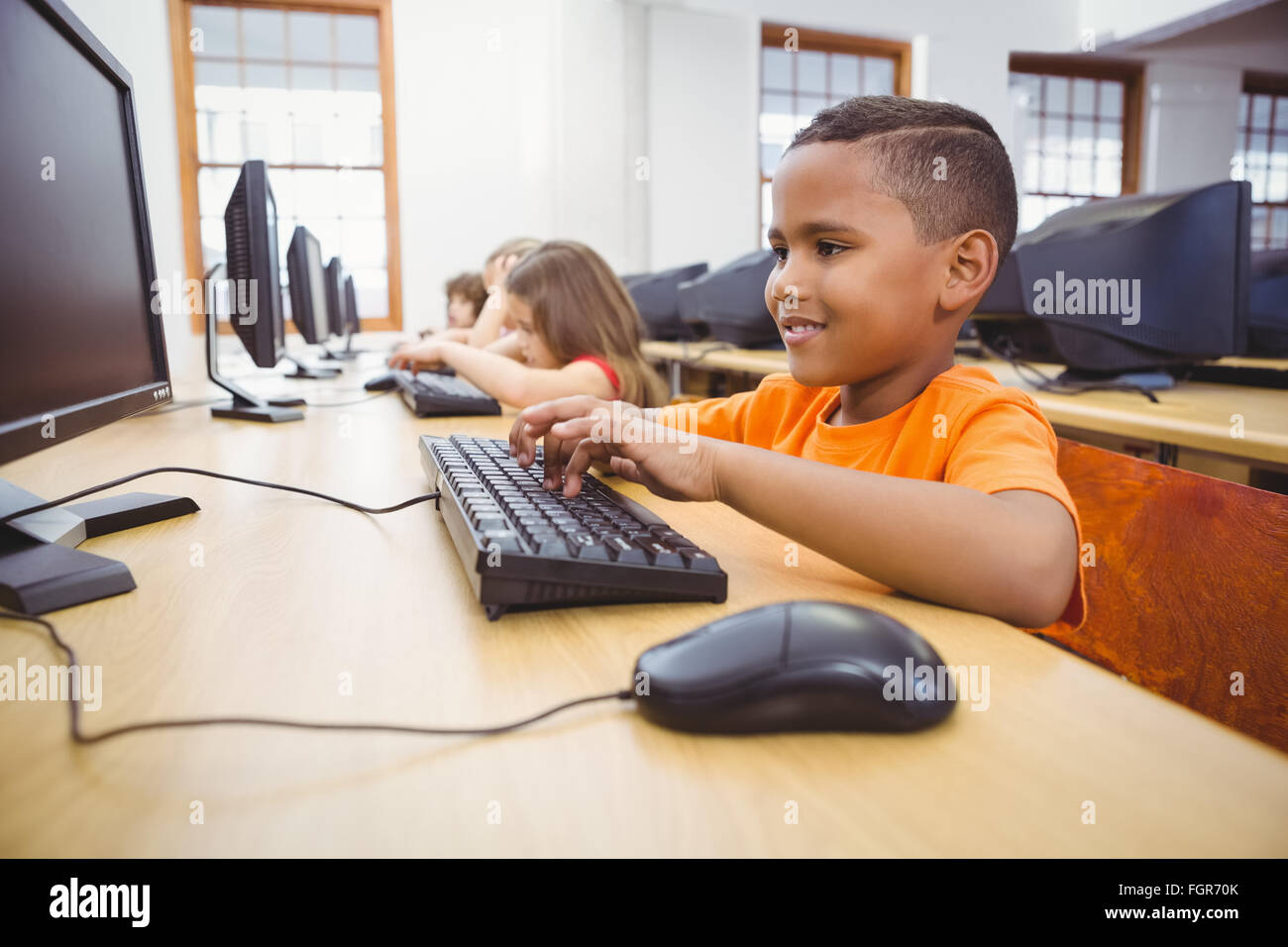 Smiling student using a computer Stock Photo - Alamy