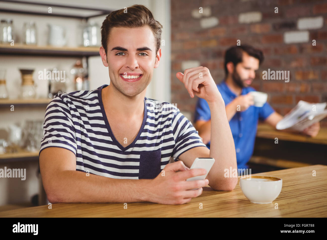 Happy man drinking a coffee Stock Photo - Alamy