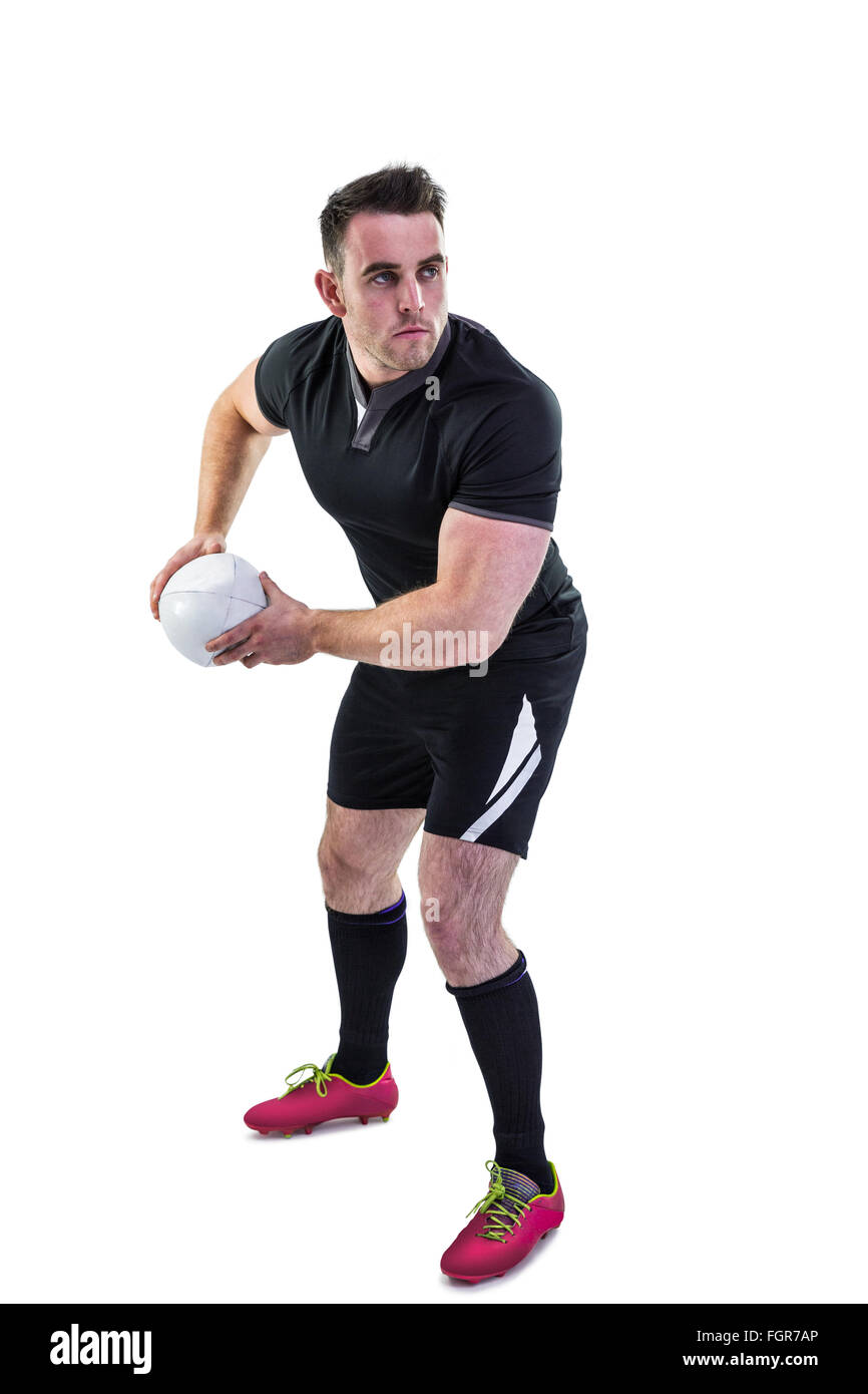 Rugby player throwing the ball Stock Photo - Alamy