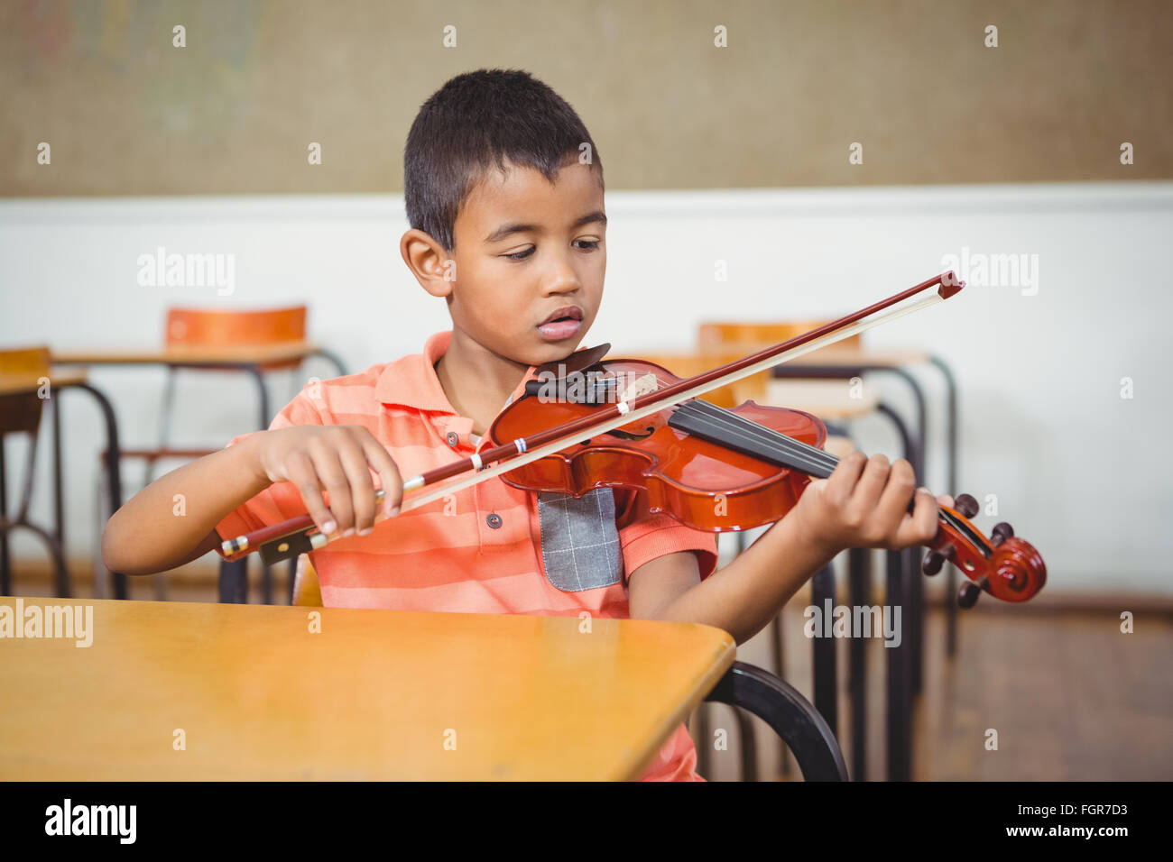 Student using a violin in class Stock Photo - Alamy
