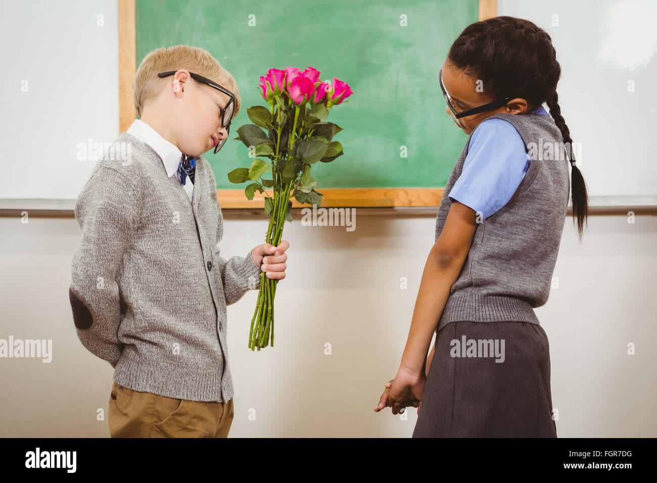 Student giving flowers to another student Stock Photo - Alamy