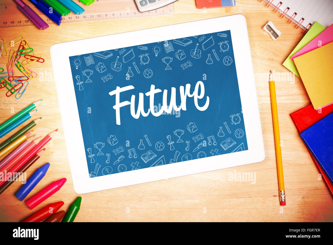 Future against students desk with tablet pc Stock Photo - Alamy