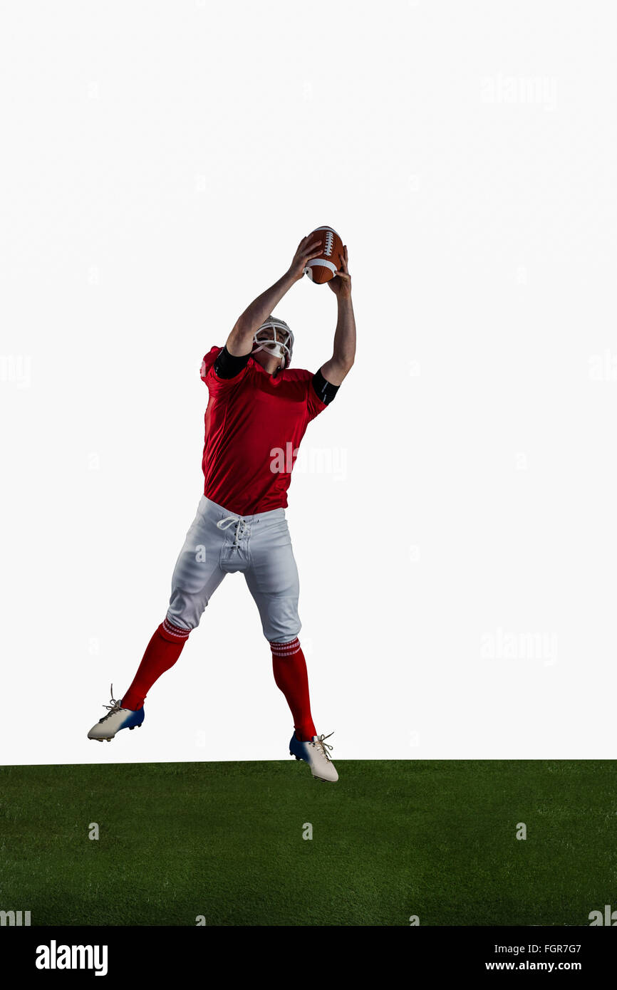 American football player catching football Stock Photo - Alamy