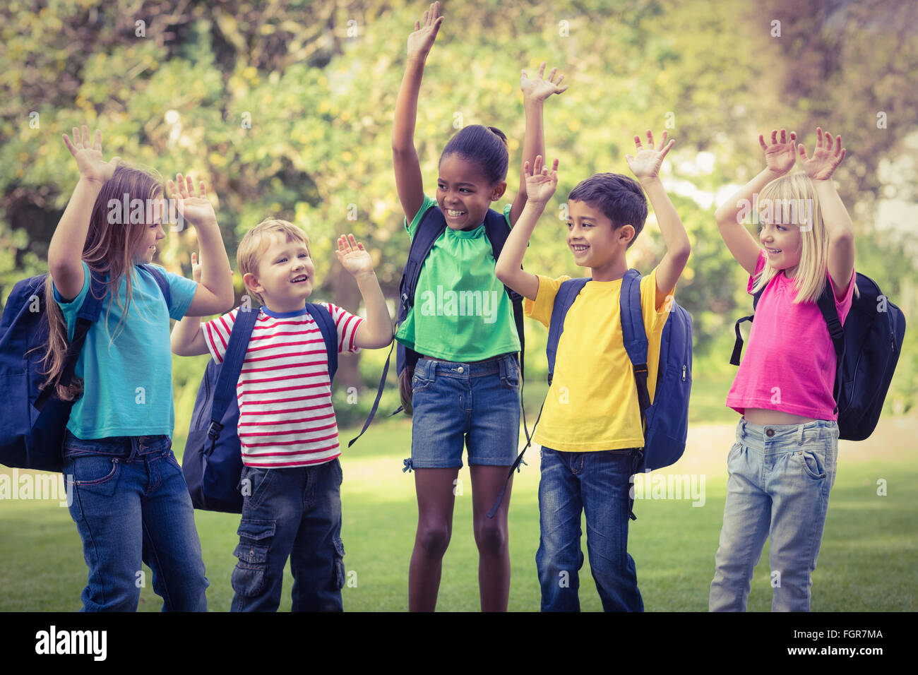 Smiling classmates cheering and standing in a row Stock Photo - Alamy