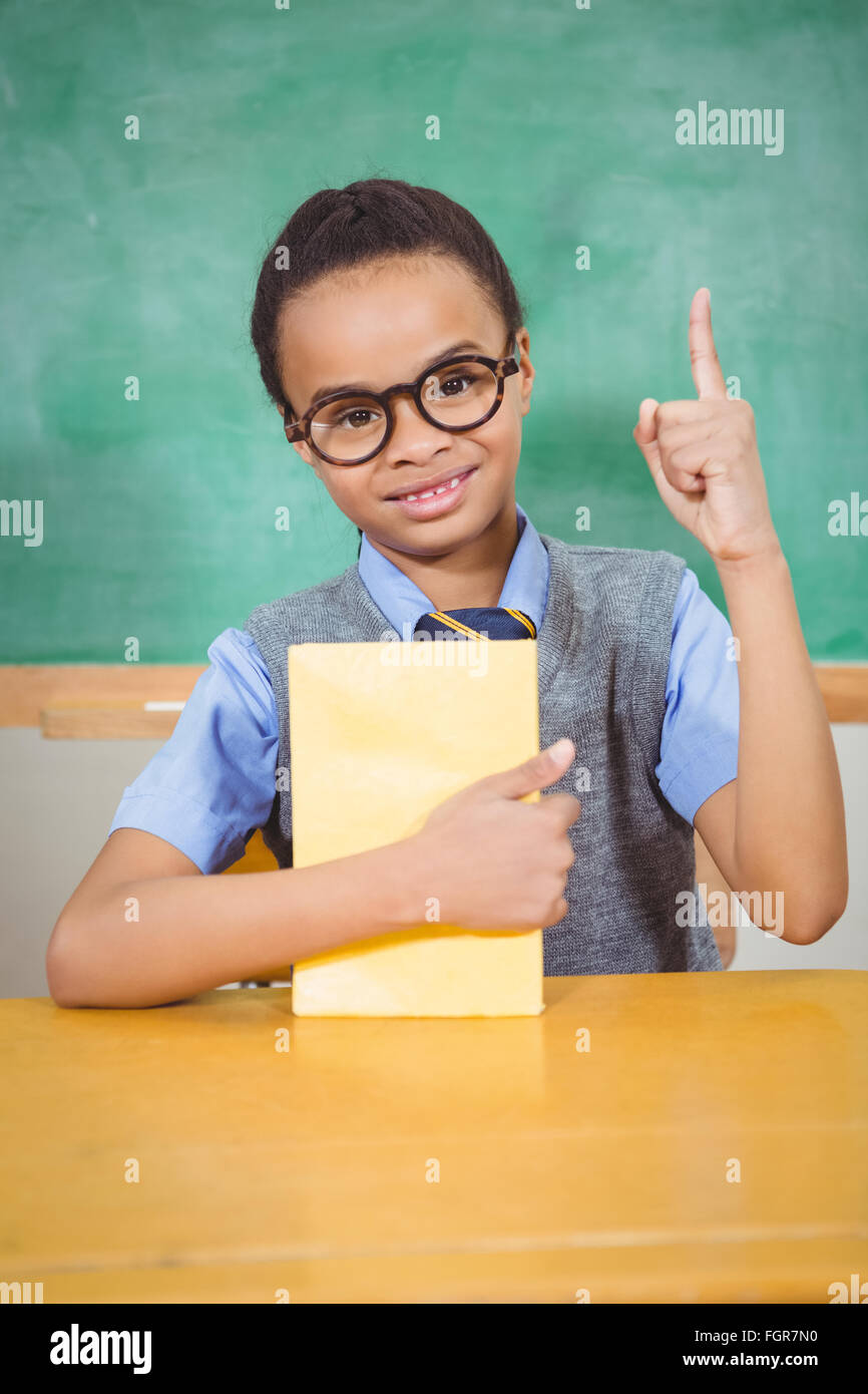 Smart student raising hand to answer a question Stock Photo - Alamy