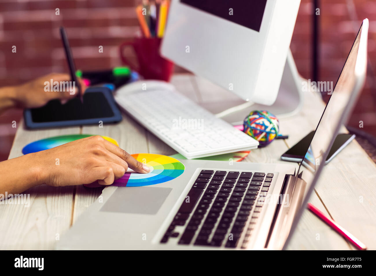 Graphic designer working with colour chart and digitizer Stock Photo ...