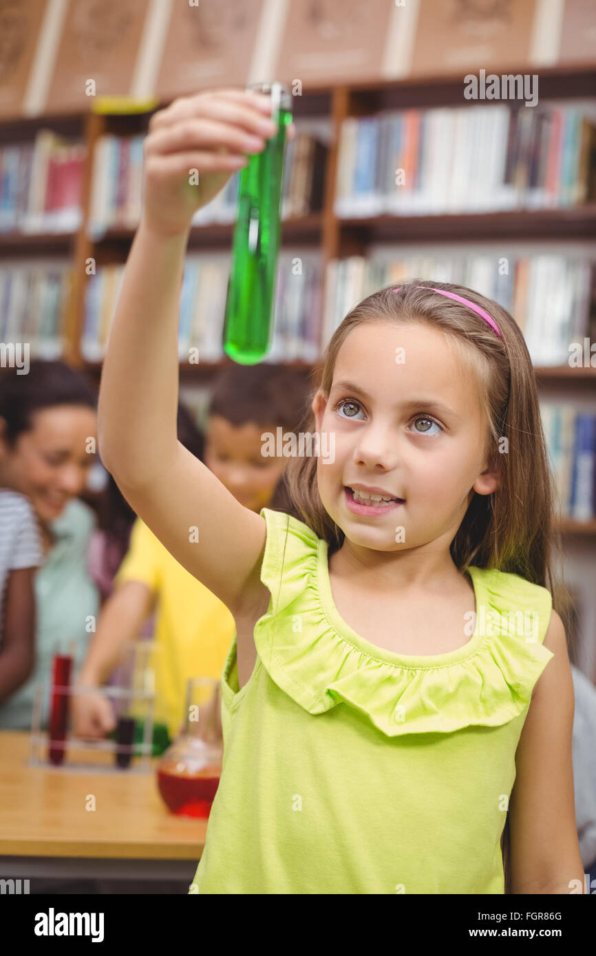 Pupil doing science in library Stock Photo - Alamy