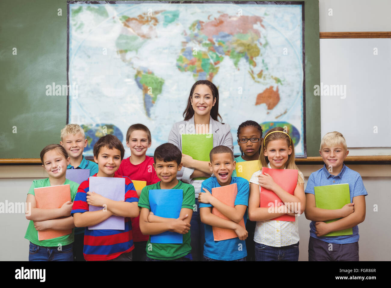 Students standing with the teacher Stock Photo - Alamy