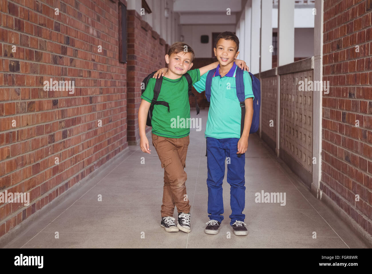 Smiling happy students looking at the camera Stock Photo - Alamy