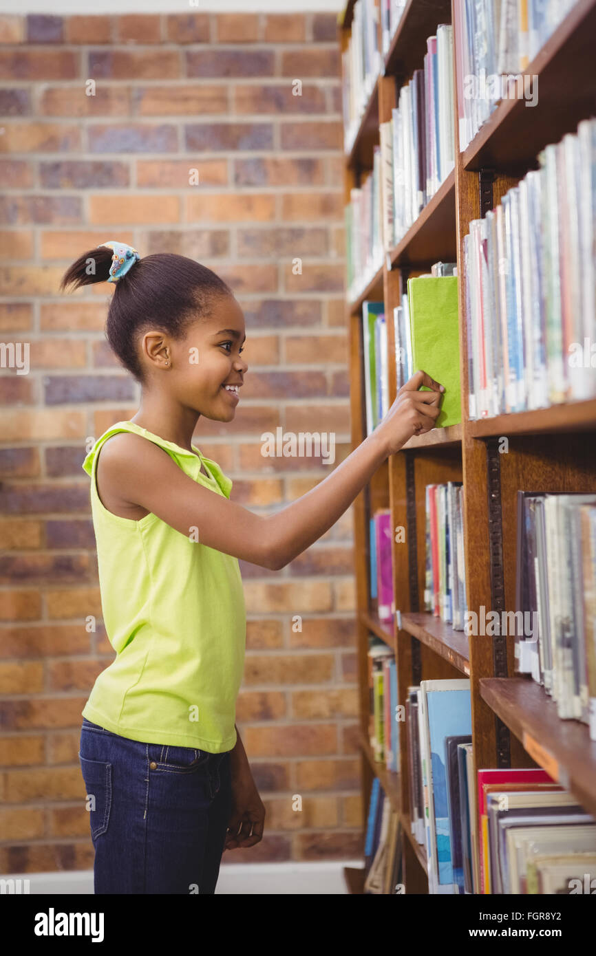 Boy choosing book library hi-res stock photography and images - Alamy