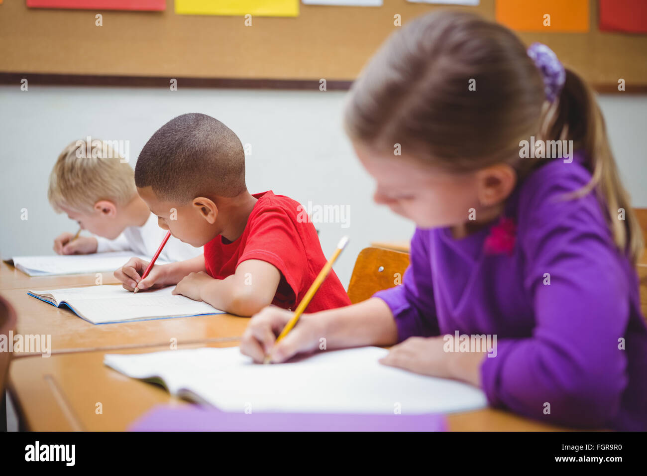 Busy students working on class work Stock Photo - Alamy