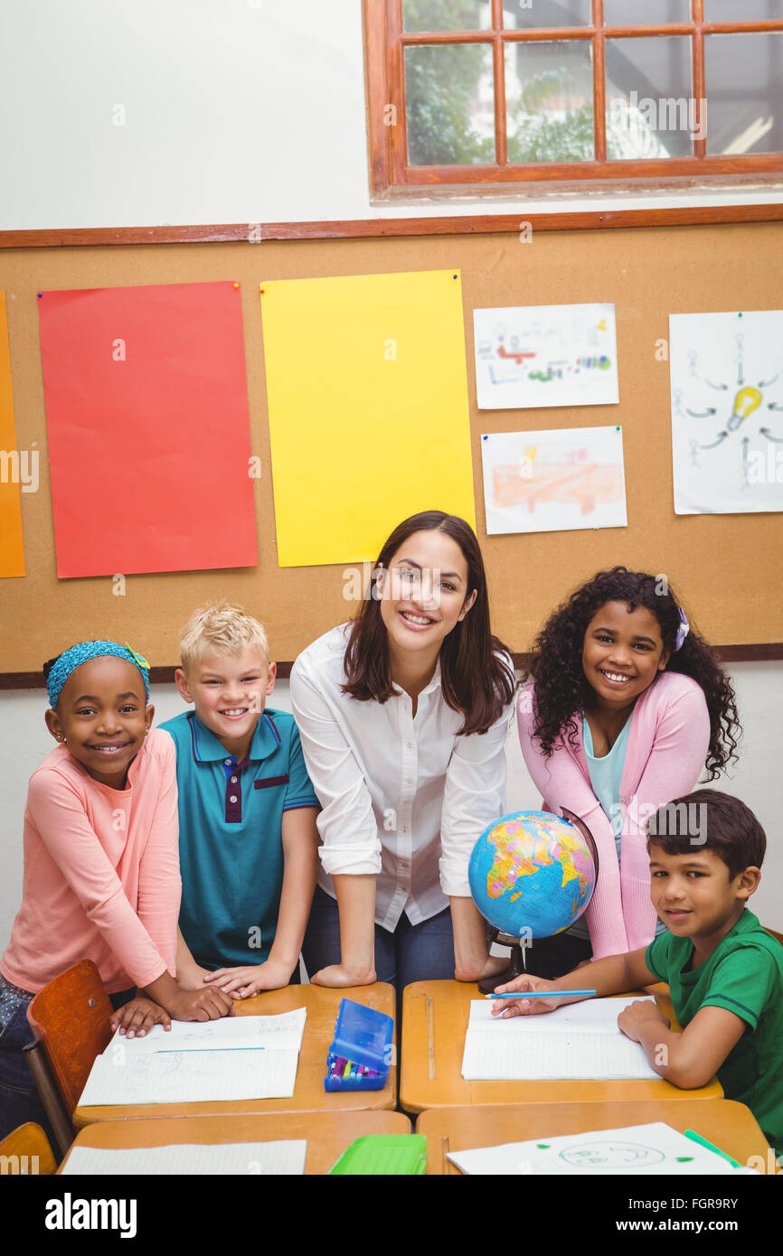 Students and teacher looking at the camera Stock Photo - Alamy