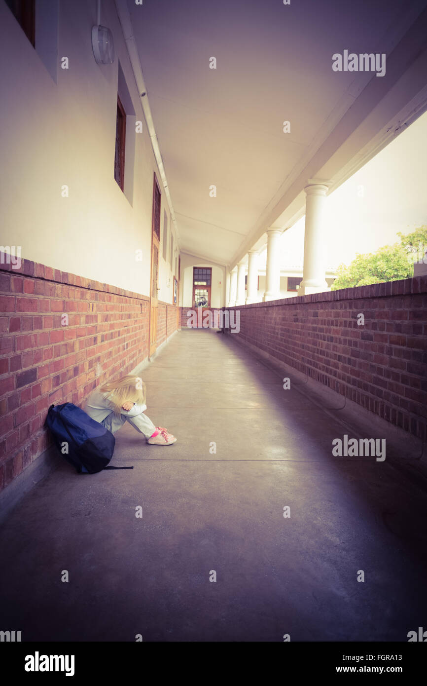 Child sitting school hallway sad hi-res stock photography and images ...