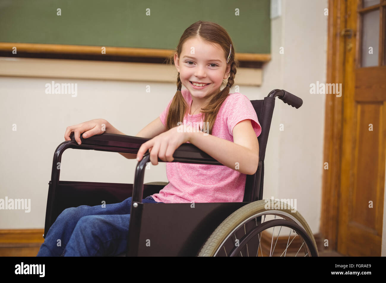 Disabled pupil smiling at camera Stock Photo - Alamy