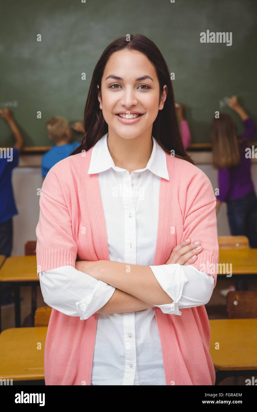 Teacher standing with students at blackboard Stock Photo - Alamy