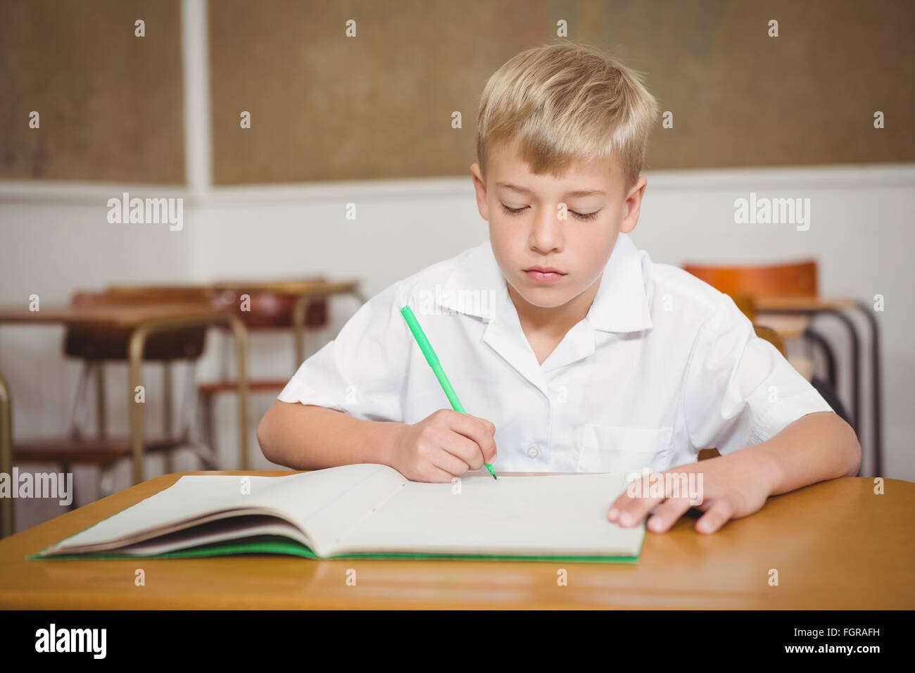 Busy student working on class work Stock Photo - Alamy
