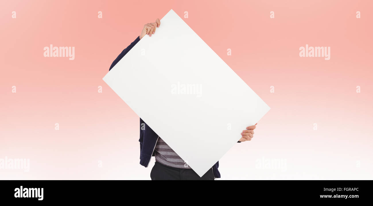 Composite image of man holding billboard in front of face Stock Photo ...