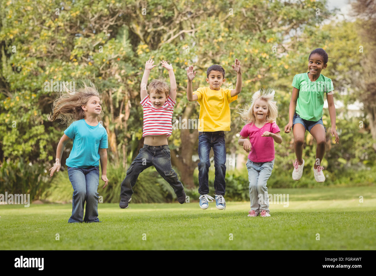 Happy smiling boy jumping in air hi-res stock photography and images ...