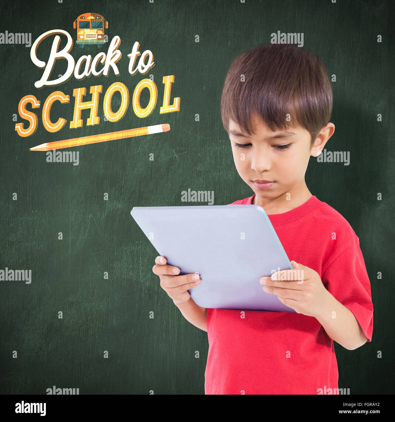 Composite image of cute boy using tablet Stock Photo - Alamy