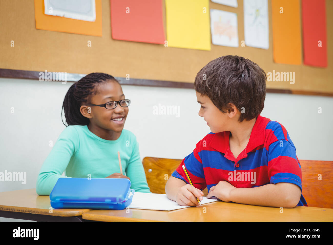 Smiling students looking at each other Stock Photo - Alamy