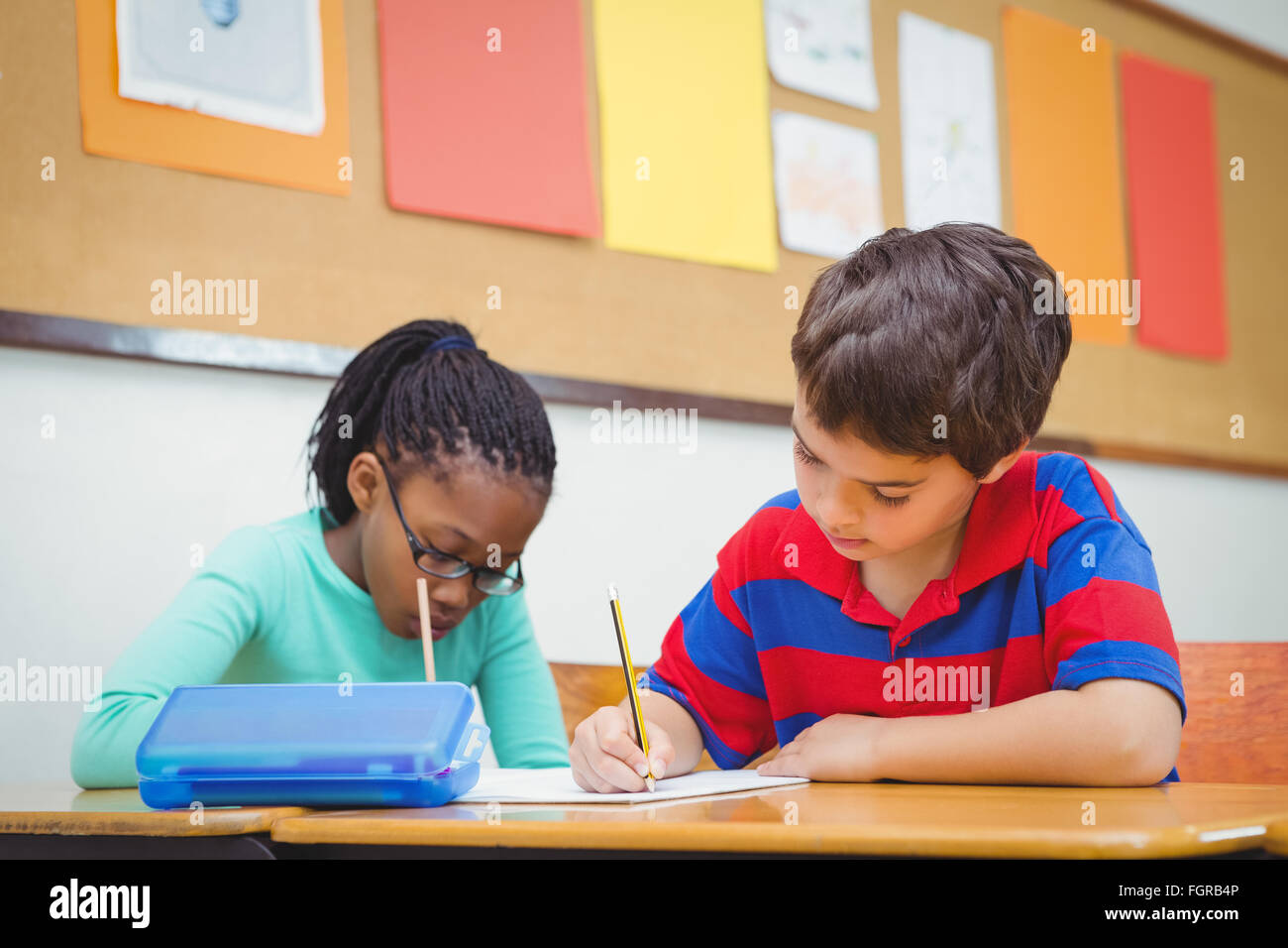Busy students working on class work Stock Photo - Alamy