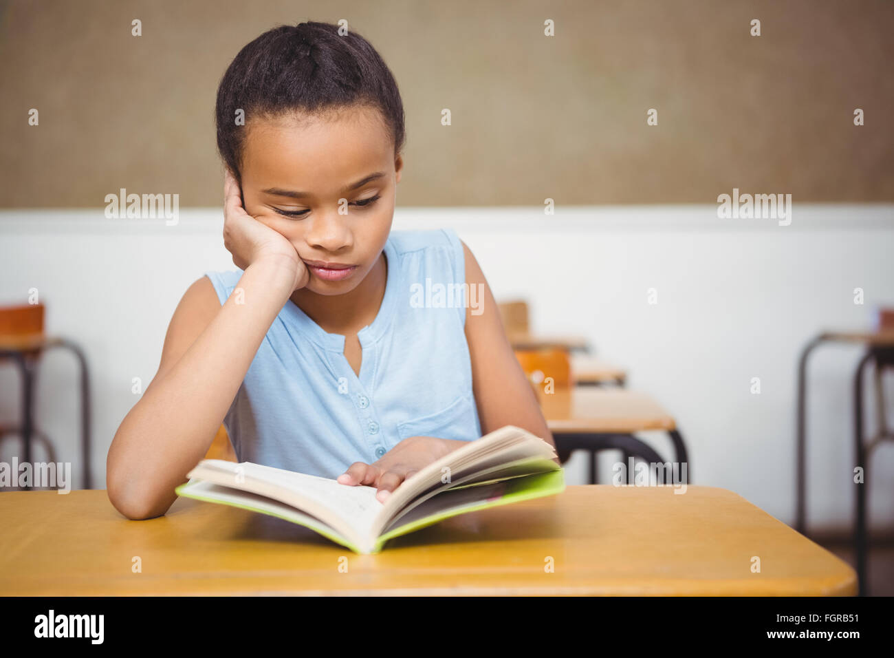 Concentrated student reading a book Stock Photo - Alamy