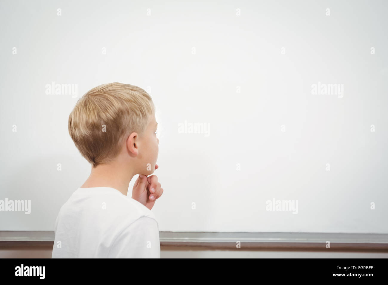 Puzzled student looking at whiteboard Stock Photo - Alamy