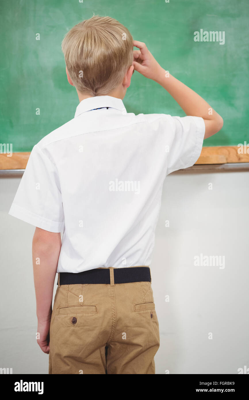 Puzzled student looking at blackboard Stock Photo - Alamy