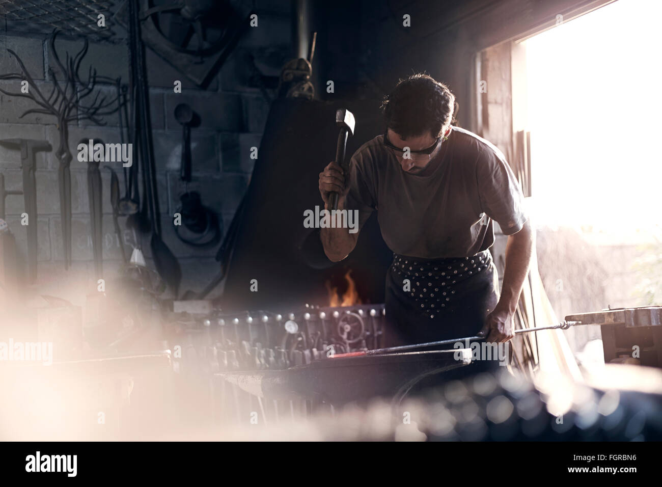 Craftsman forging iron tool in hi-res stock photography and images - Alamy