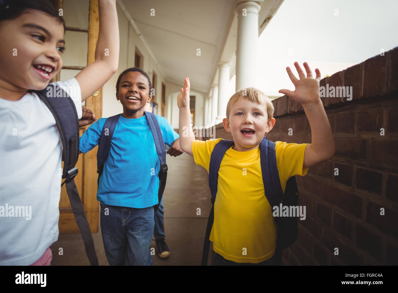 Happy pupils leaving the classroom Stock Photo - Alamy