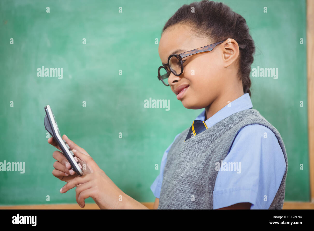 Smart student holding a calculator Stock Photo - Alamy