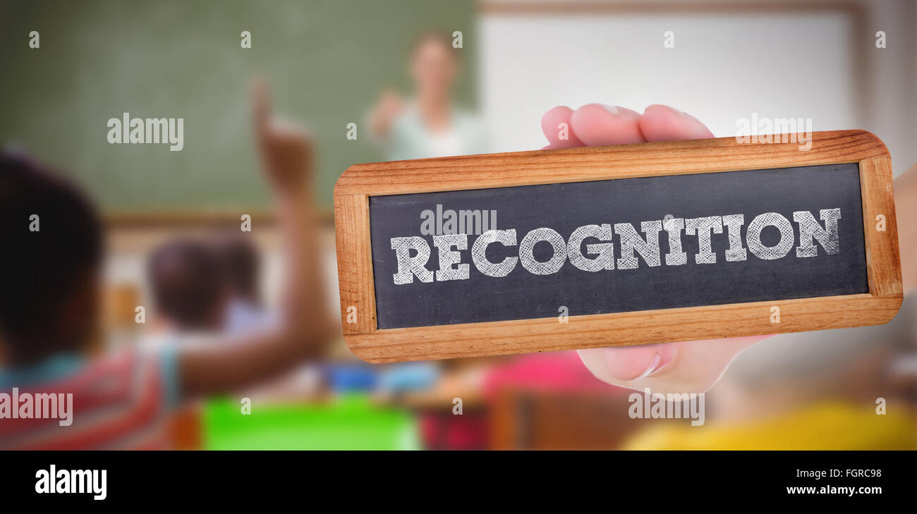 Recognition against pupils raising their hands during class Stock Photo ...