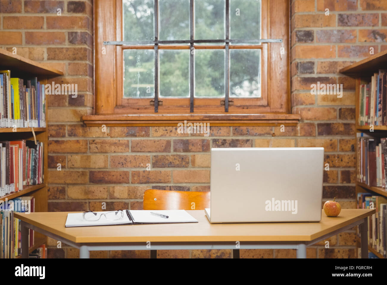 Desk with laptop, glasses and ledger on it Stock Photo - Alamy