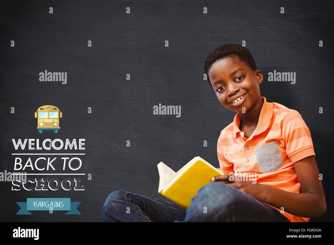 Composite image of cute boy reading book in library Stock Photo - Alamy