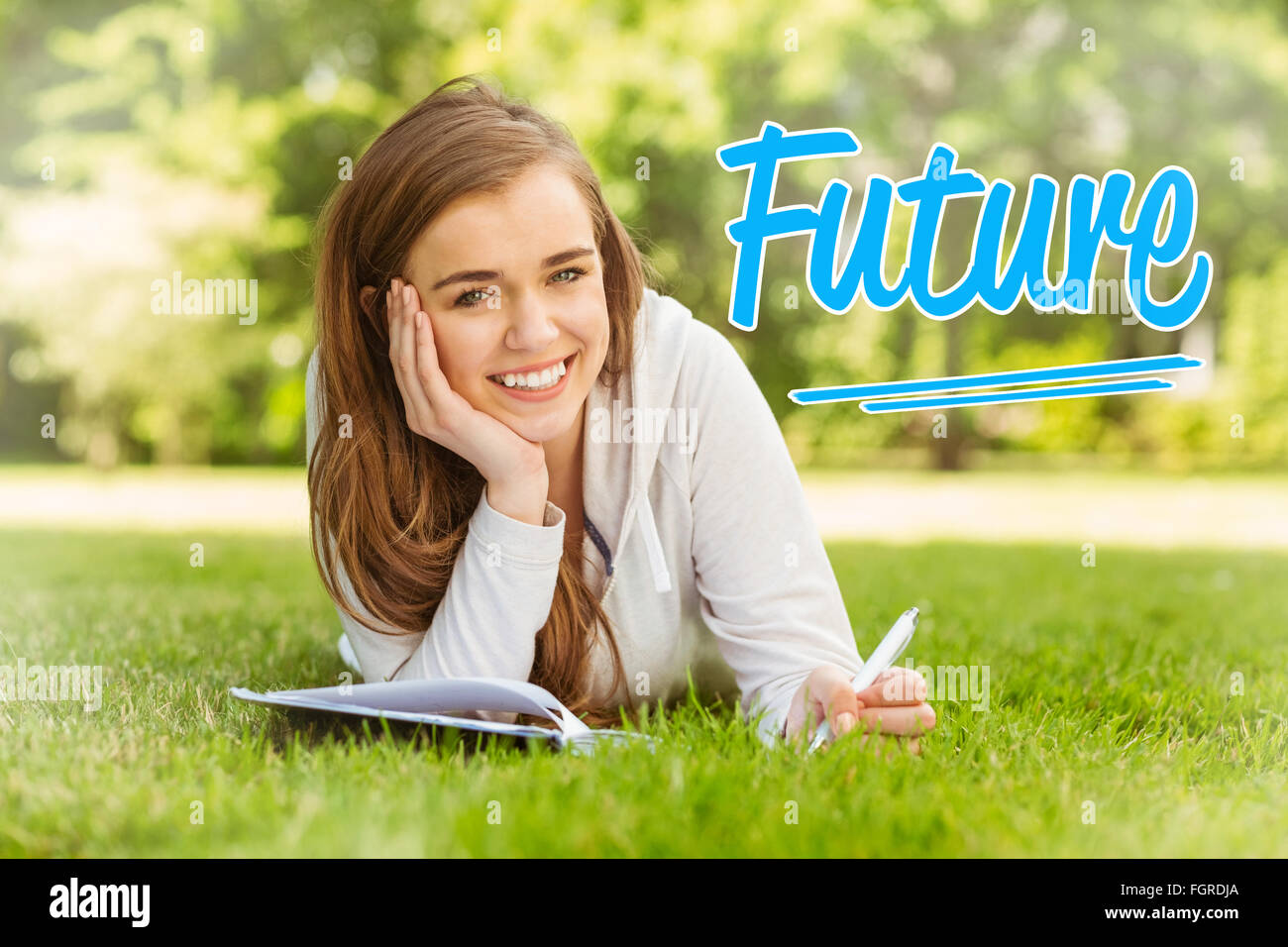 Future against smiling university student lying and writing on notepad ...