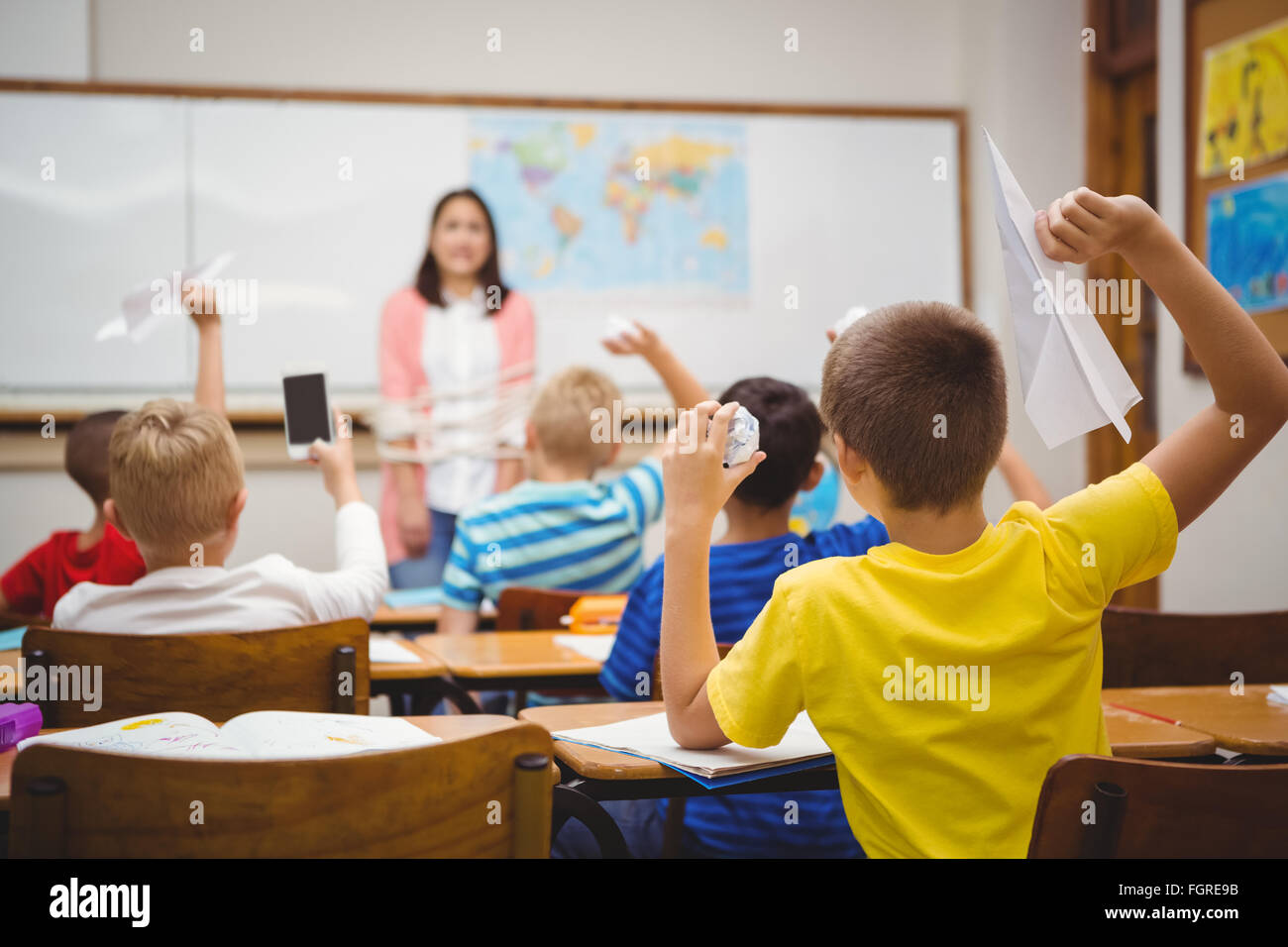 Students paper airplane classroom hi-res stock photography and images ...