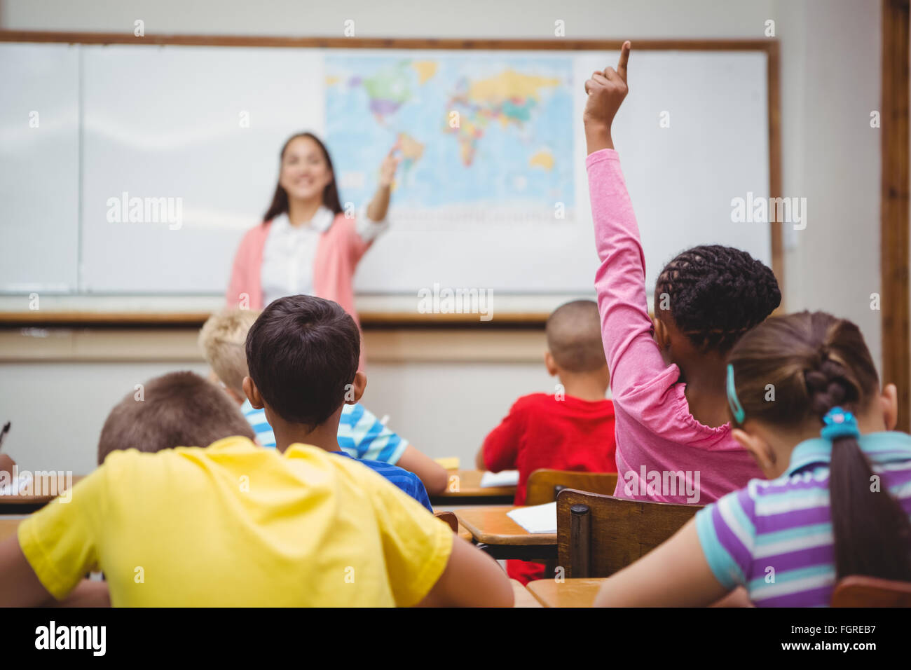 Student raising hand to ask a question Stock Photo - Alamy