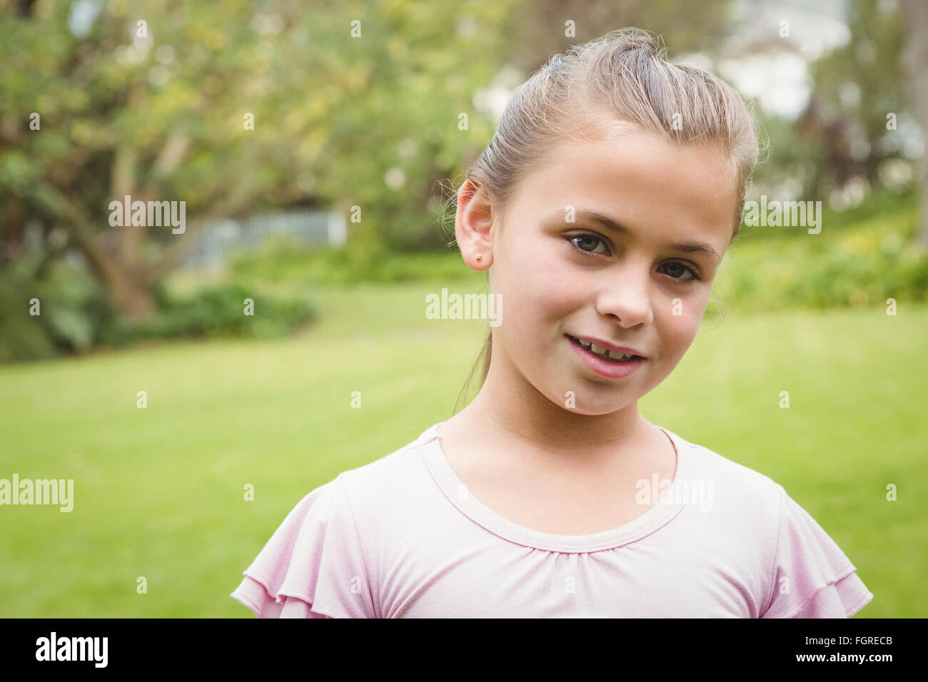 A Smiling kid standing outside Stock Photo - Alamy