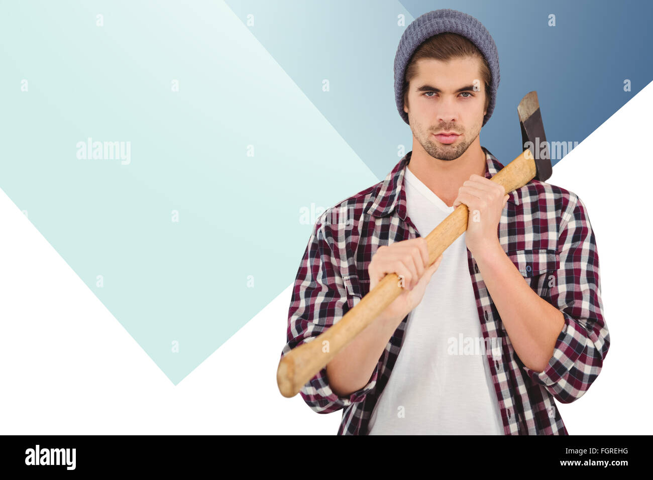 Composite image of portrait of confident man holding axe on shoulder ...