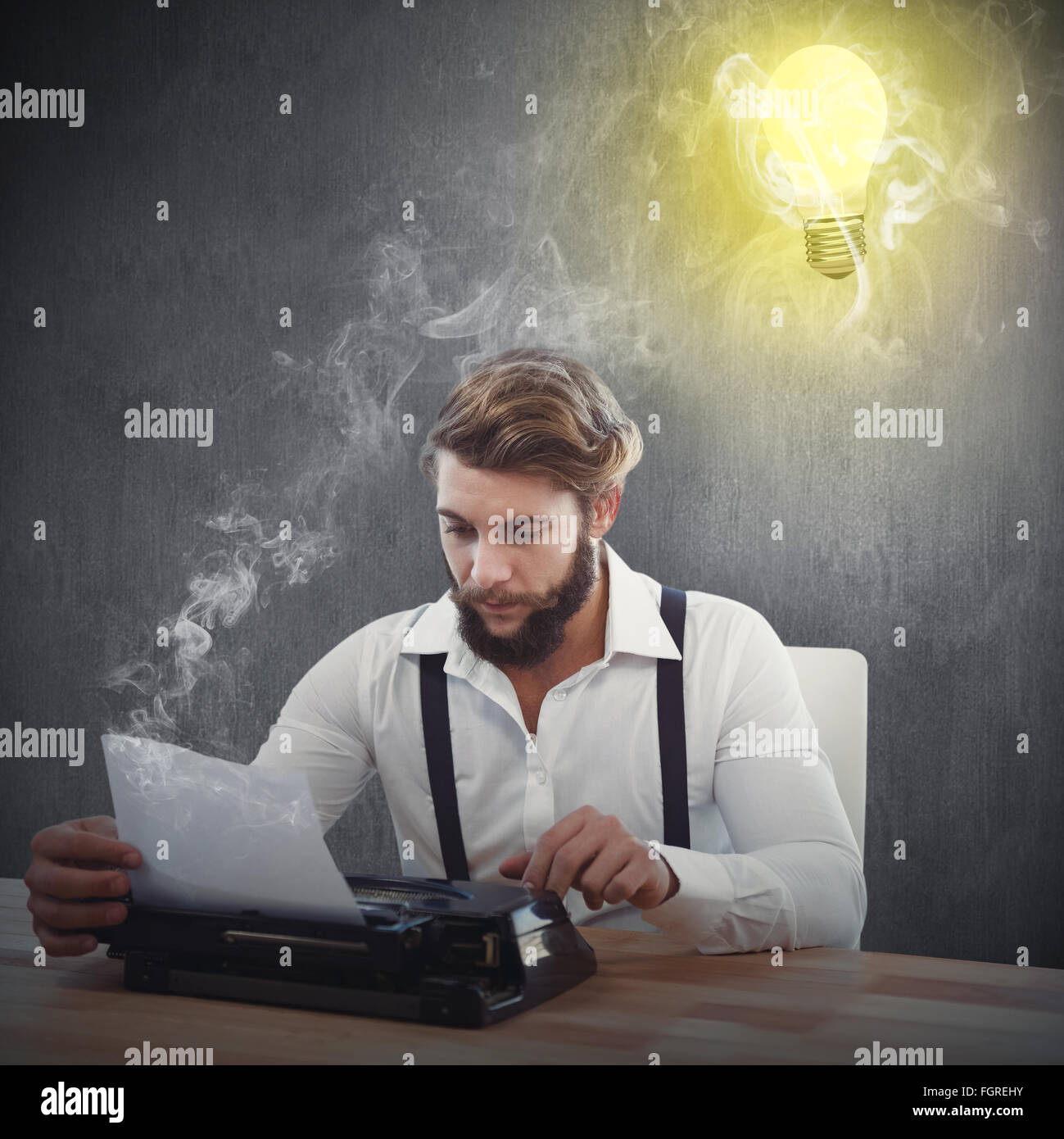 Composite image of hipster using typewriter at desk in office Stock ...